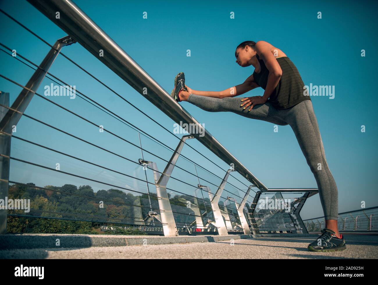 Stretching muscles on the leg before the training stock photo Stock ...