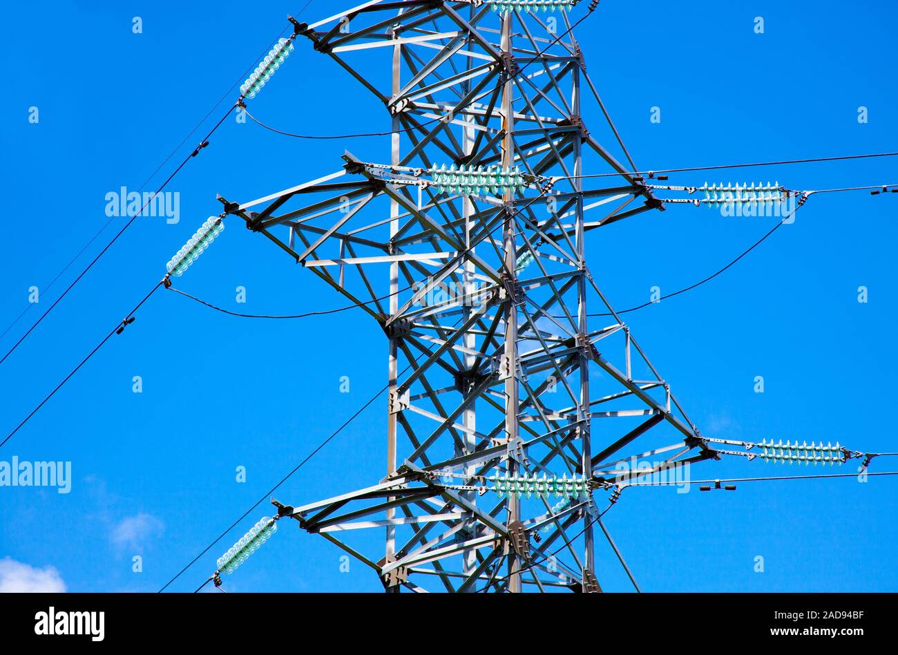 Electric power line against blue sky Stock Photo - Alamy
