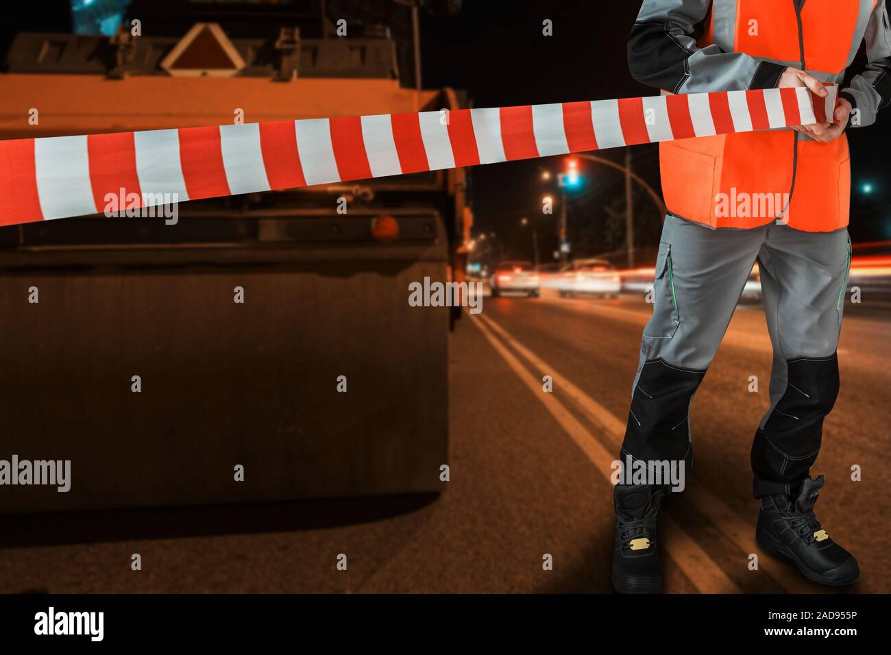 Worker blocks repair street Stock Photo - Alamy