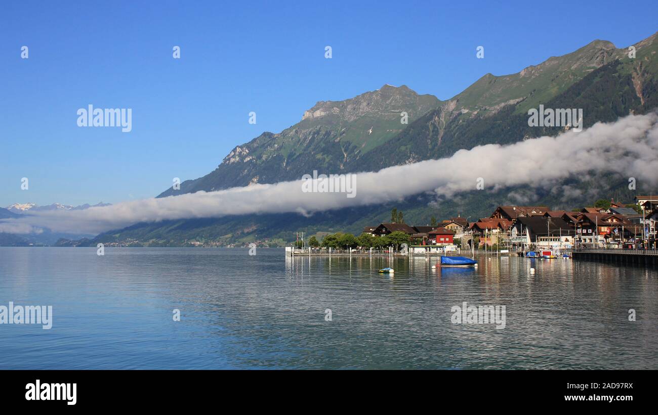 Village Brienz and Mount Augstmatthorn on a summer morning. Lake Brienz ...
