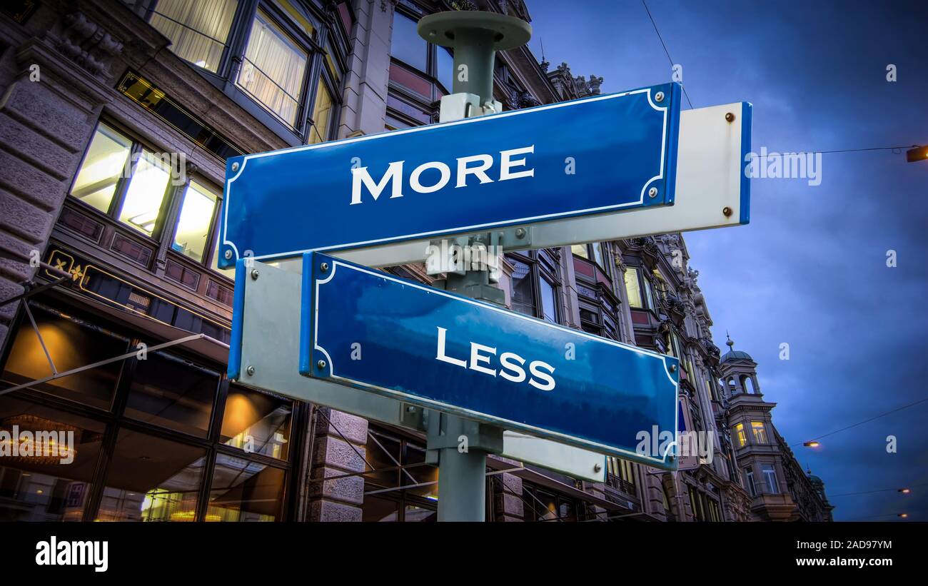 Street Sign More versus Less Stock Photo - Alamy