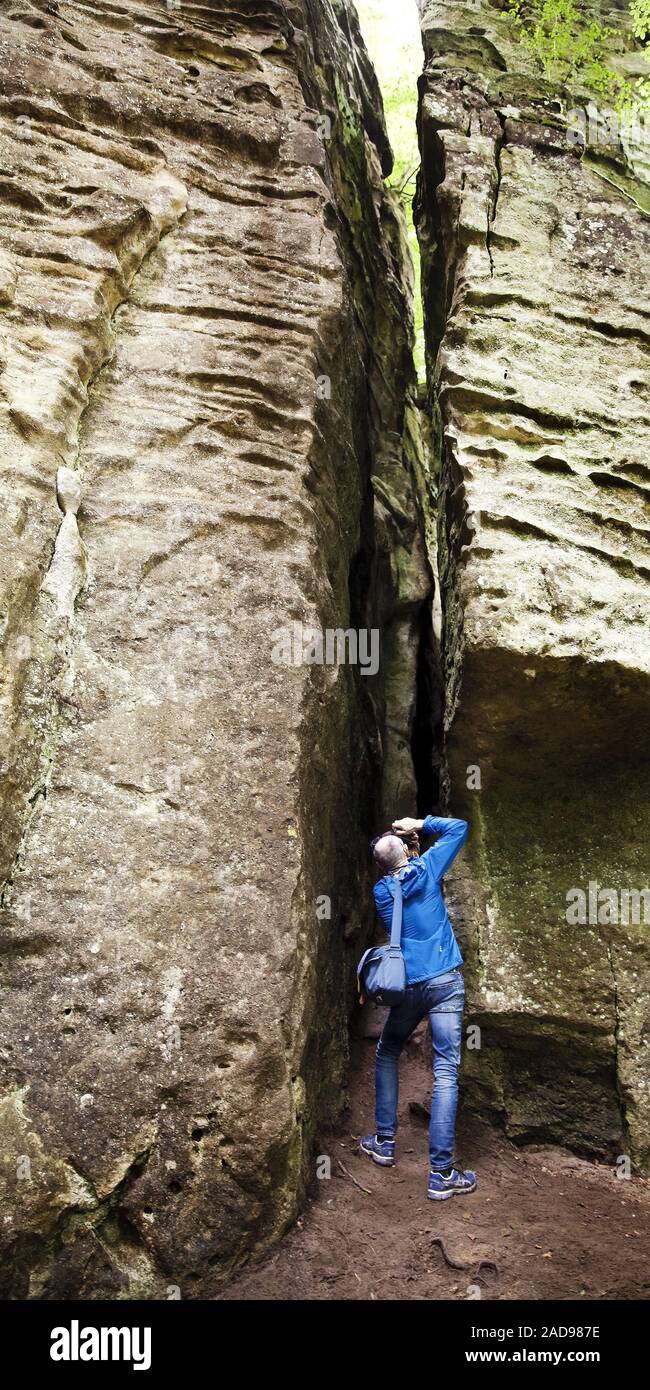 man taking photos in the Devil´s Gorge in the South Eifel Nature Park ...