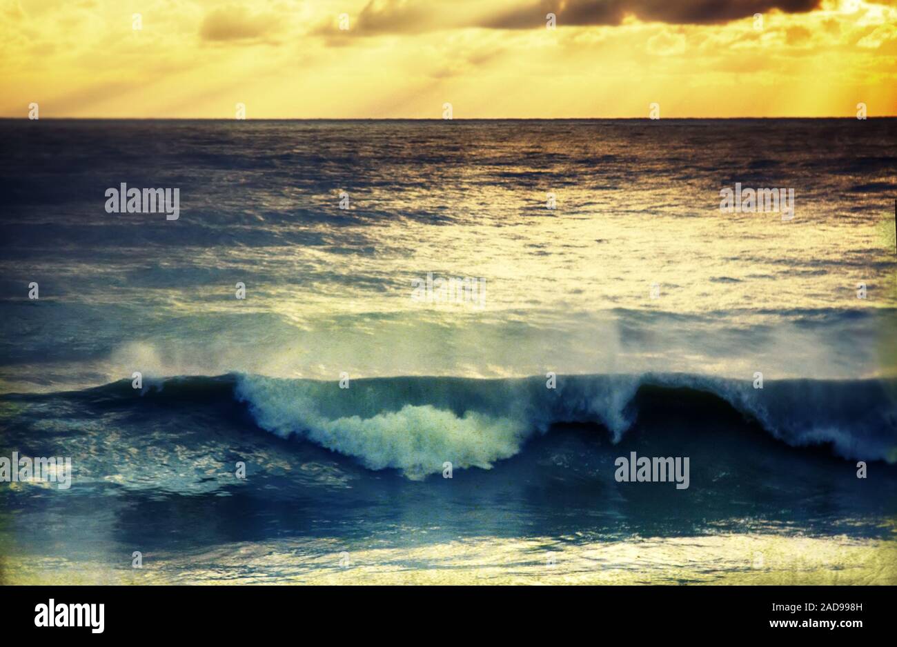 Sea roll and sunset Stock Photo - Alamy