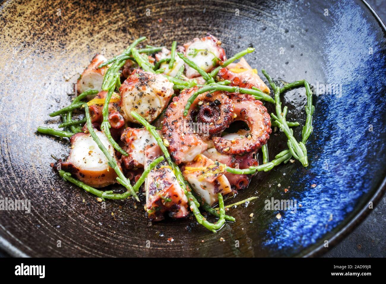 Traditional French octopus braised cooked with Salicornia Stock Photo ...