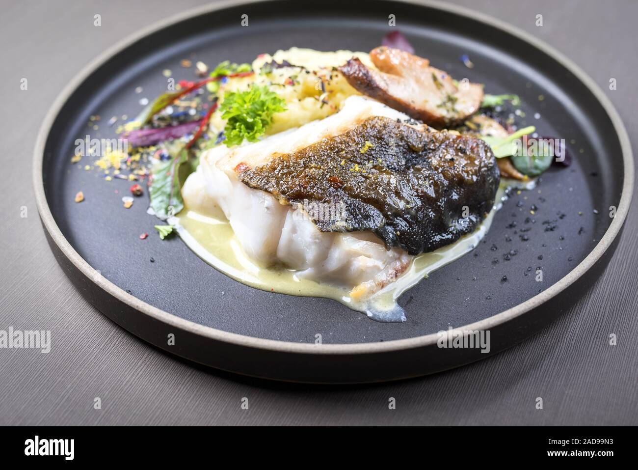 Fried Norwegian skrei cod fish filet with mashed potatoes Stock Photo ...