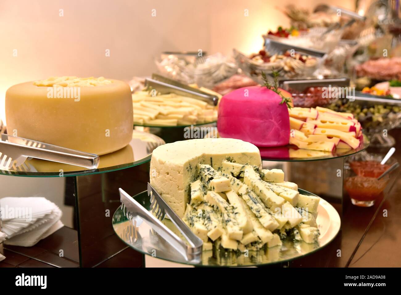 wooden table with various types of cheese Stock Photo - Alamy