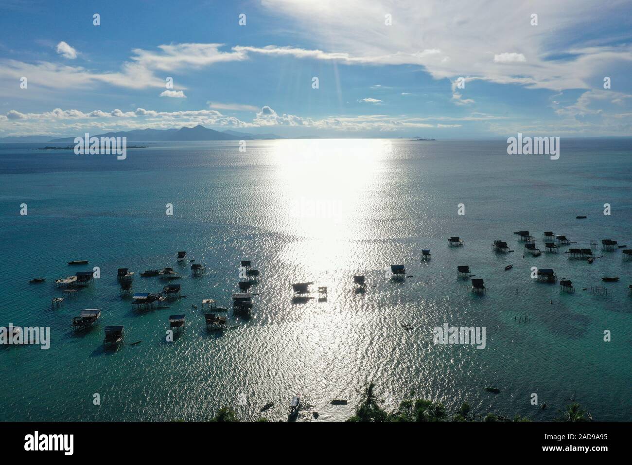 Aerial view of ocean, island and sea gypsy water village in Semporna ...