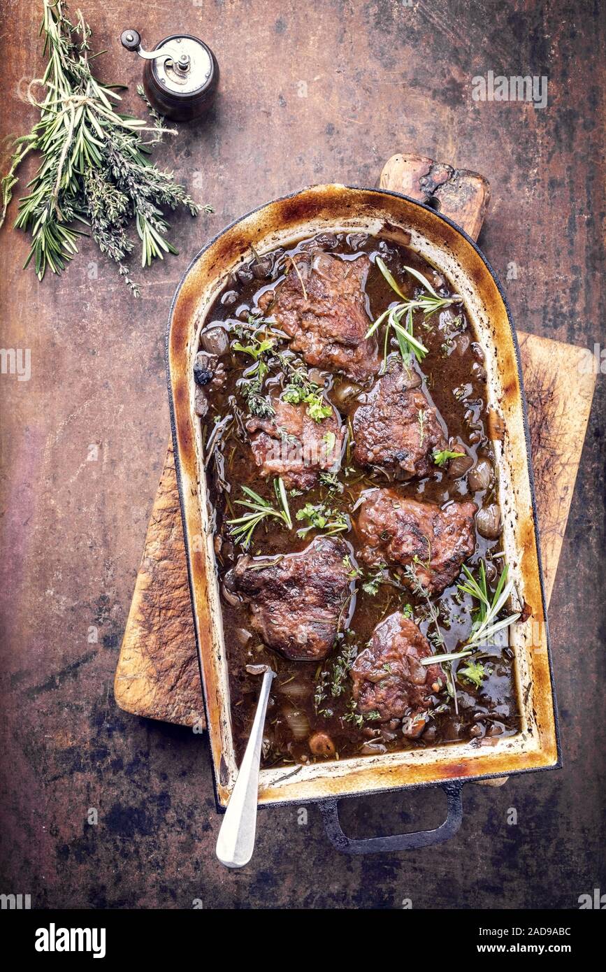 Traditional German braised veal cheeks in brown sauce with mushroom and ...