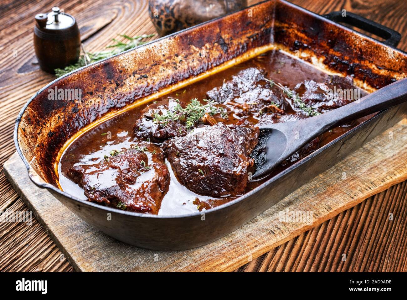 Traditional German braised veal cheeks in brown sauce with mushroom and ...