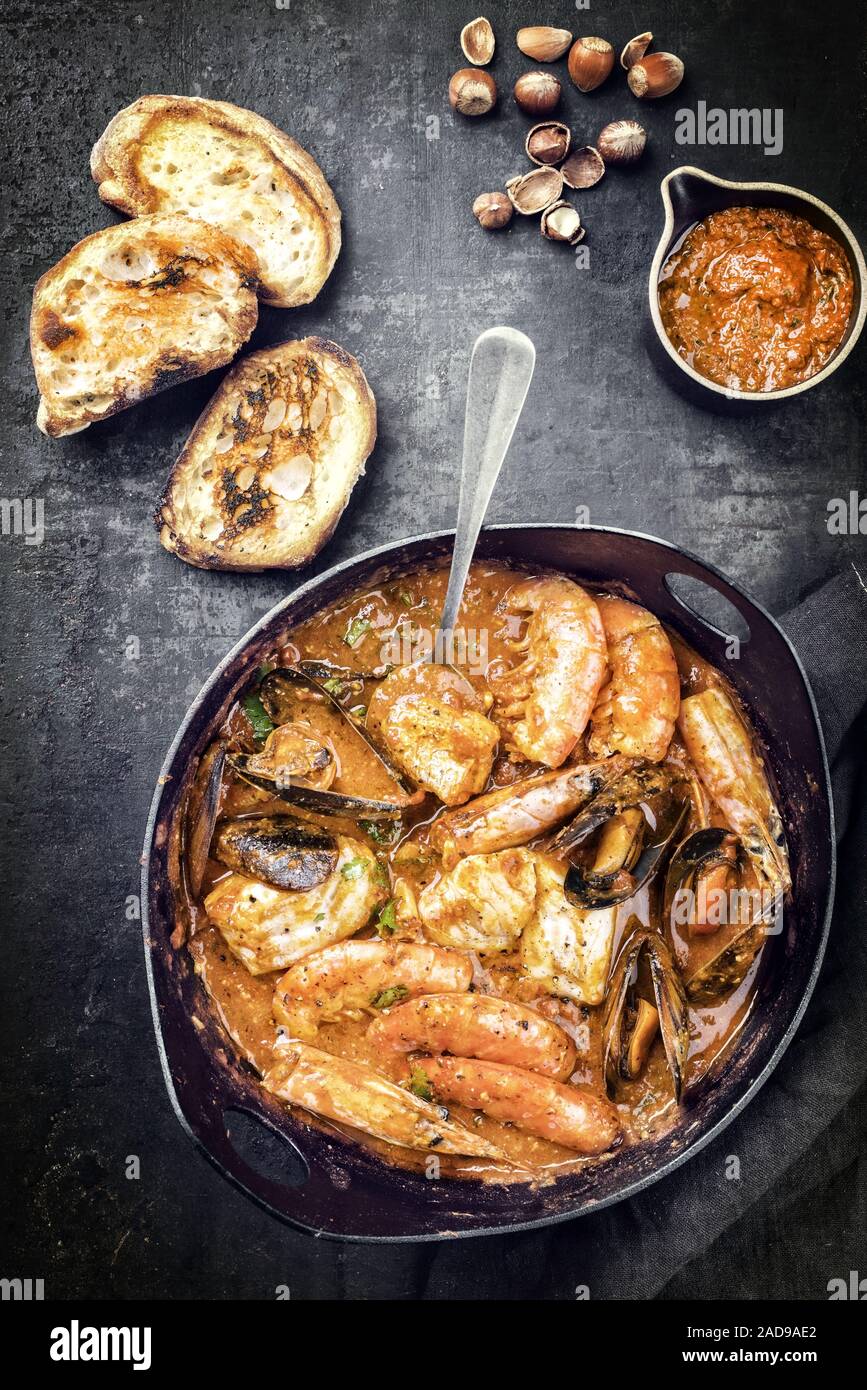 Traditional Catalan fish stew romesco de peix with prawns Stock Photo ...