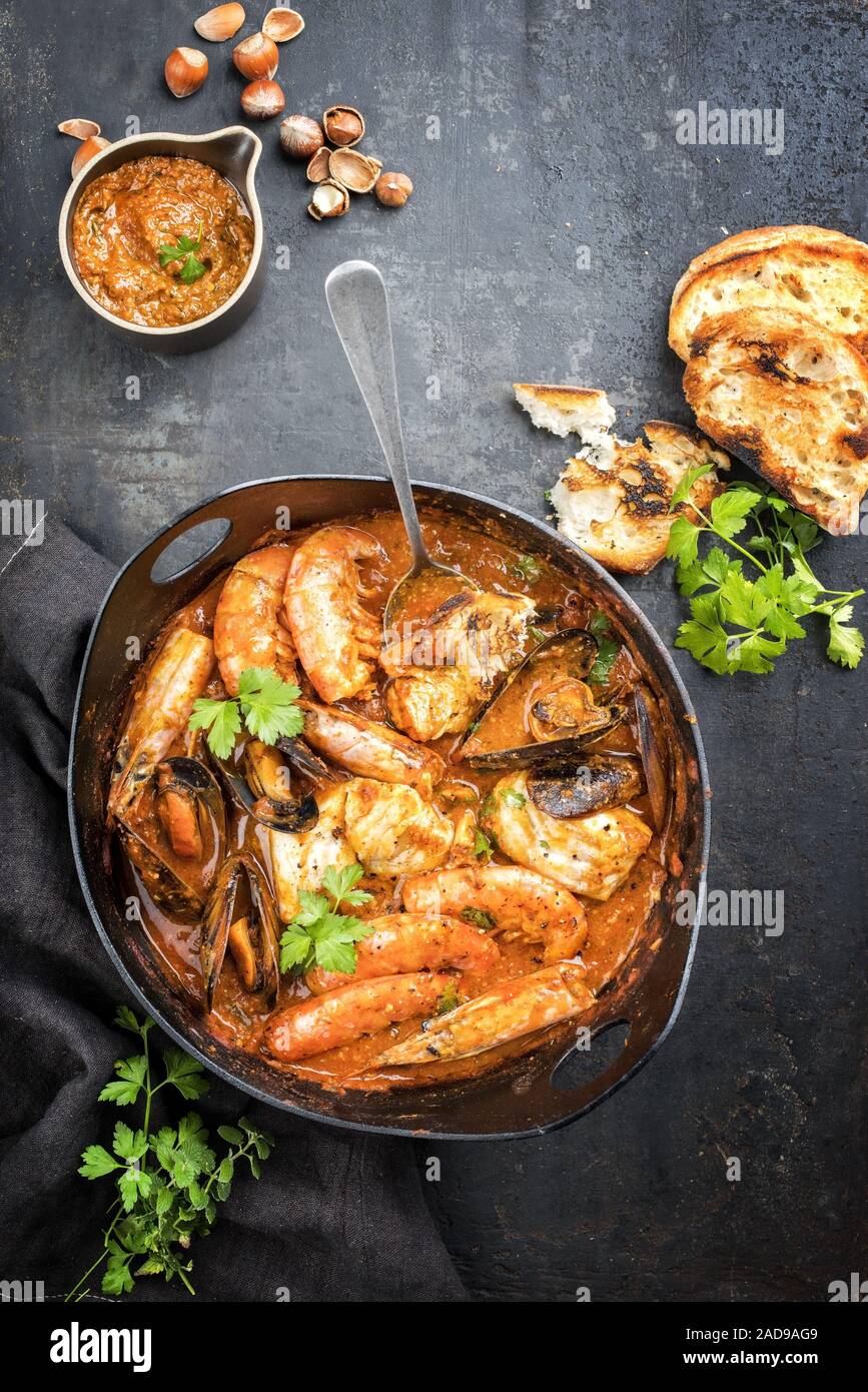 Traditional Catalan fish stew romesco de peix with prawns Stock Photo ...