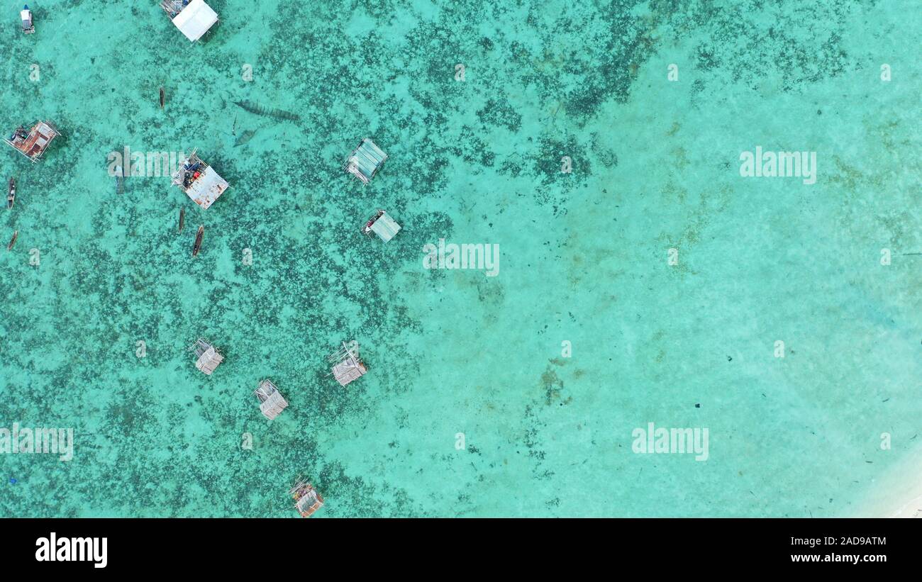 Aerial view of ocean, island and sea gypsy water village in Semporna ...