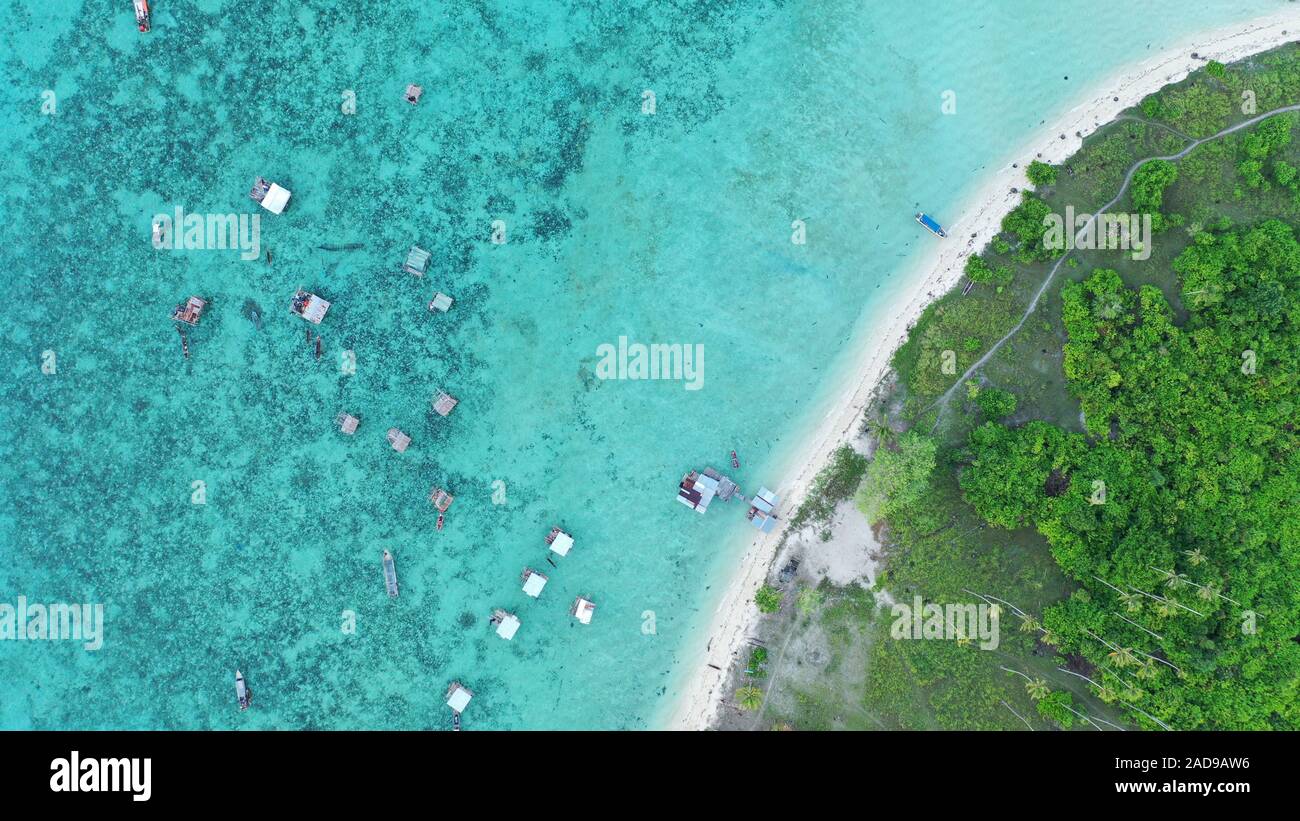 Aerial view of ocean, island and sea gypsy water village in Semporna ...