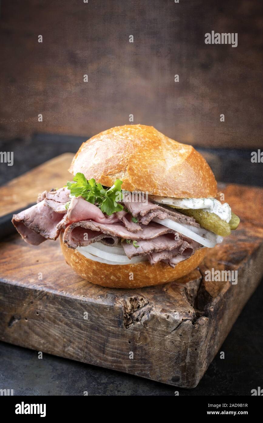 Traditional sliced cold cuts roast beef sandwich with onion Stock Photo ...