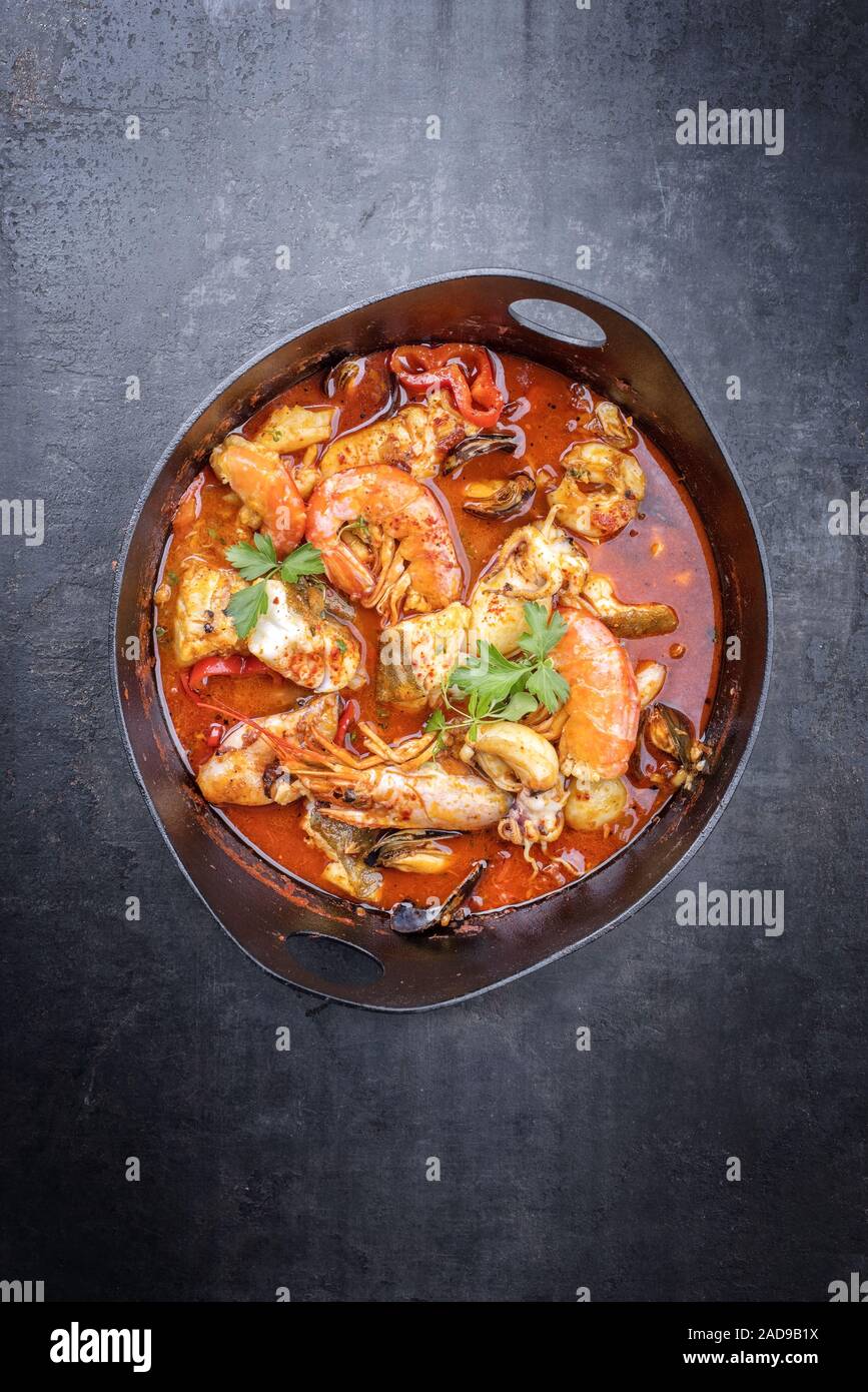 Traditional America cajun fish stew with prawns Stock Photo - Alamy