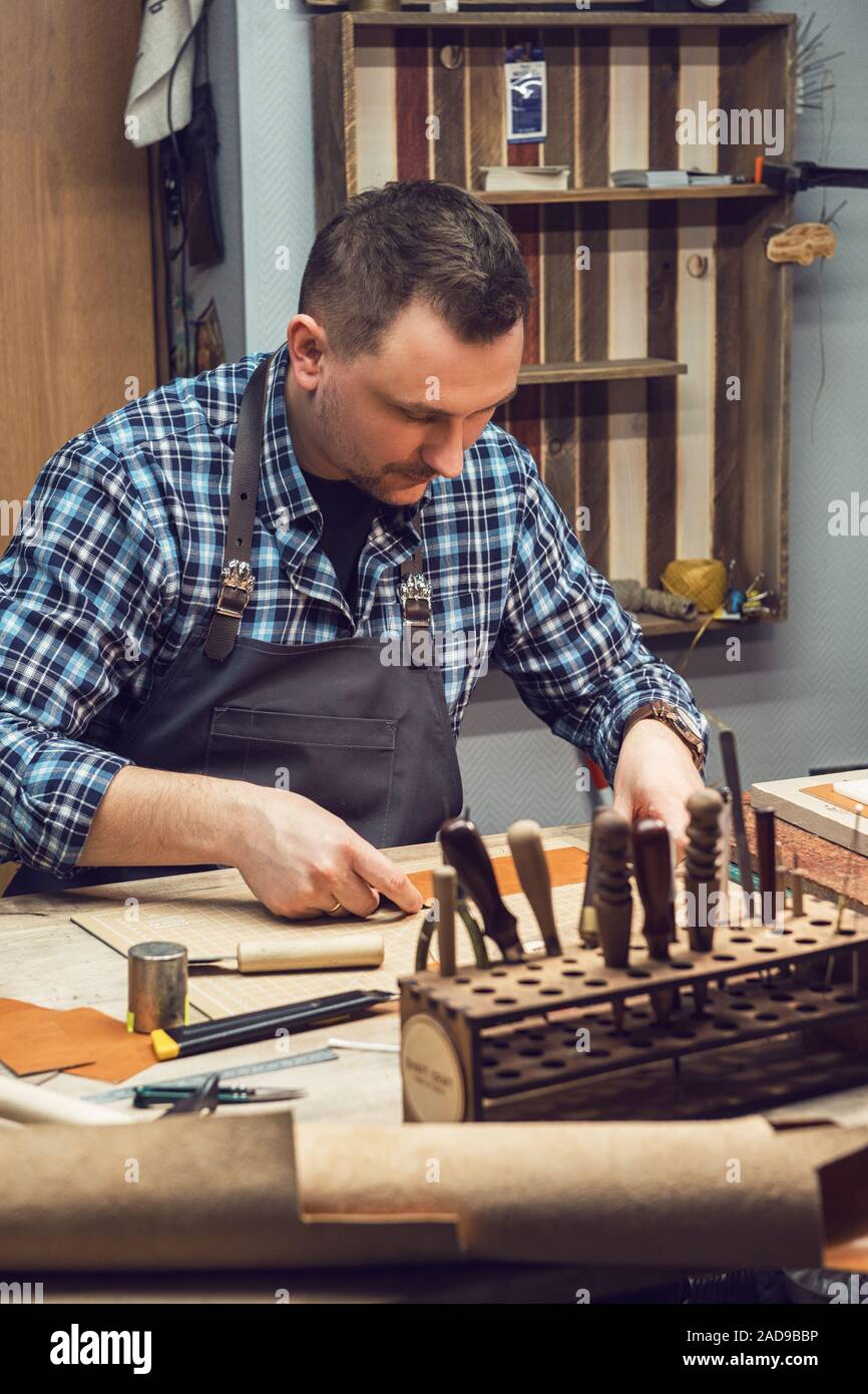 Concept of handmade craft production of leather goods Stock Photo - Alamy