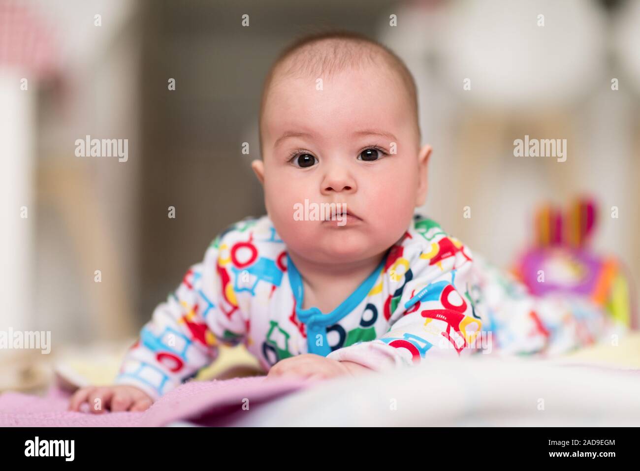 newborn baby boy playing on the floor Stock Photo - Alamy