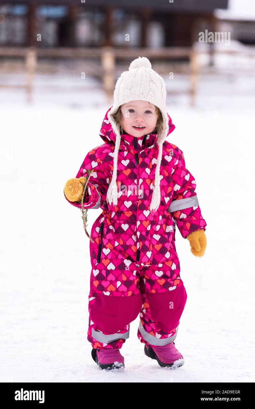 little girl having fun at snowy winter day Stock Photo - Alamy