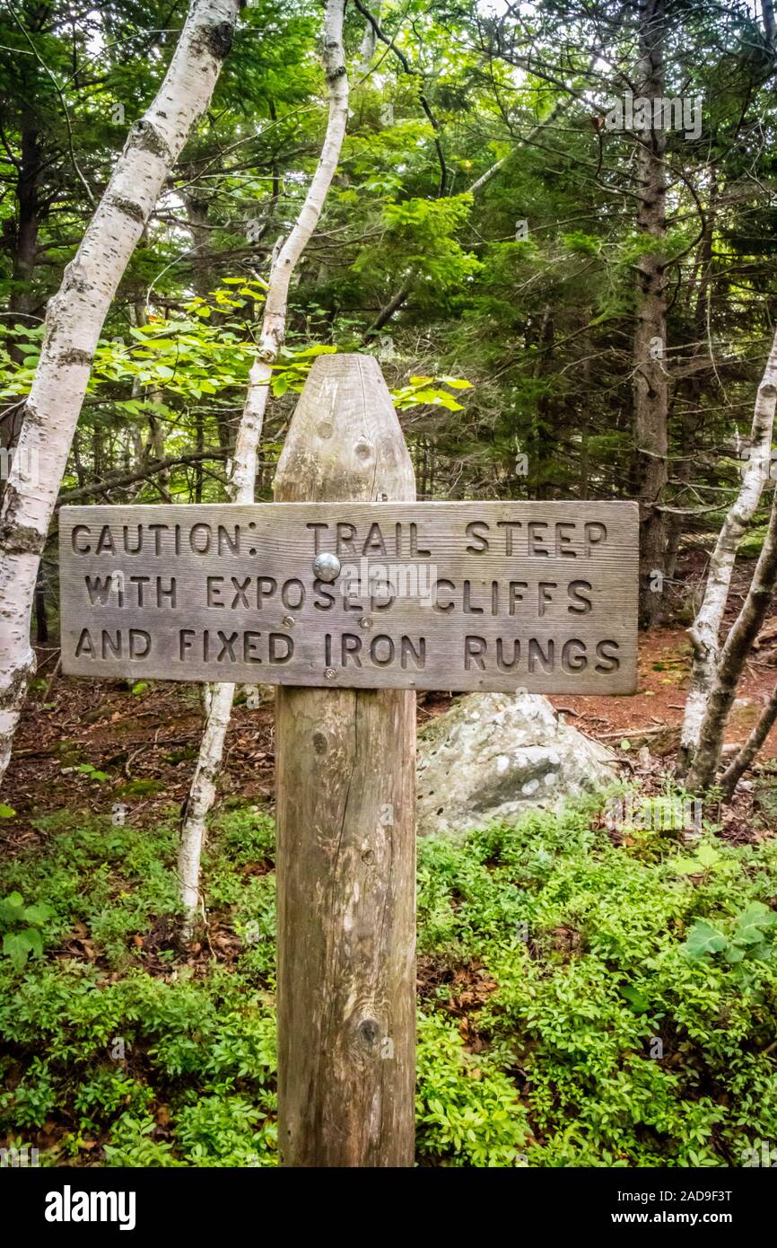 A yellow warning placard for hikers in Acadia NP, Maine Stock Photo - Alamy