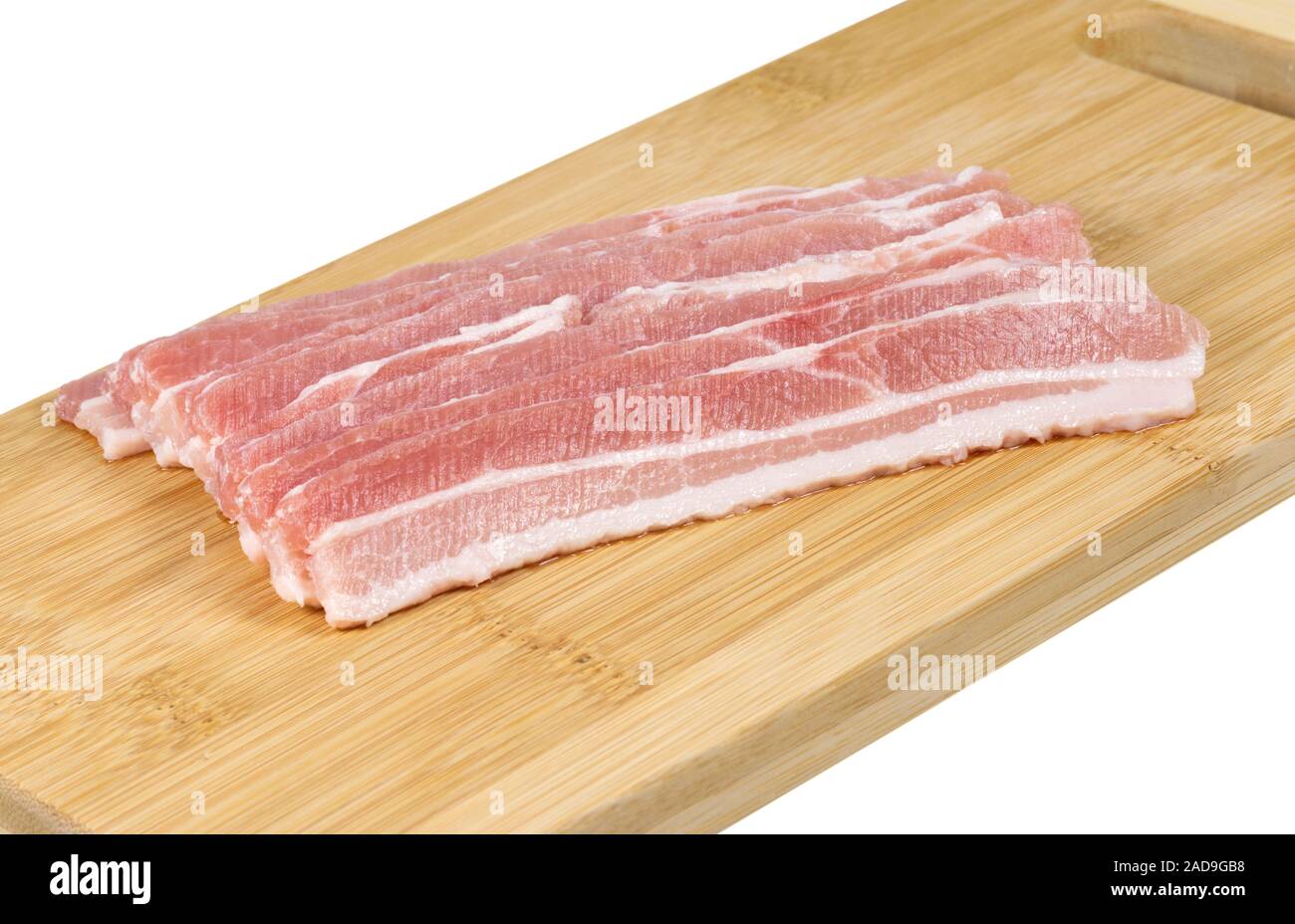 Raw bacon on the board Stock Photo - Alamy