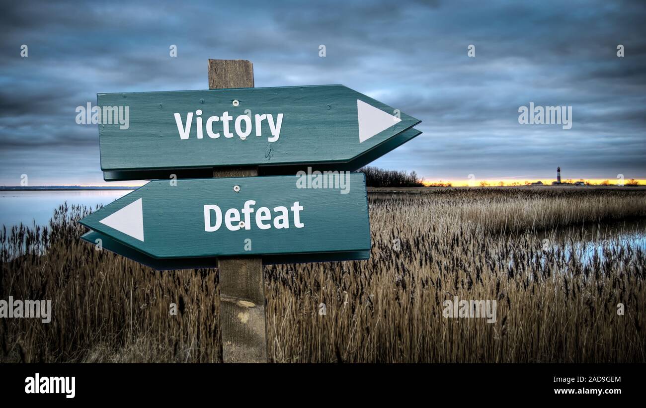 Street Sign Victory versus Defeat Stock Photo - Alamy