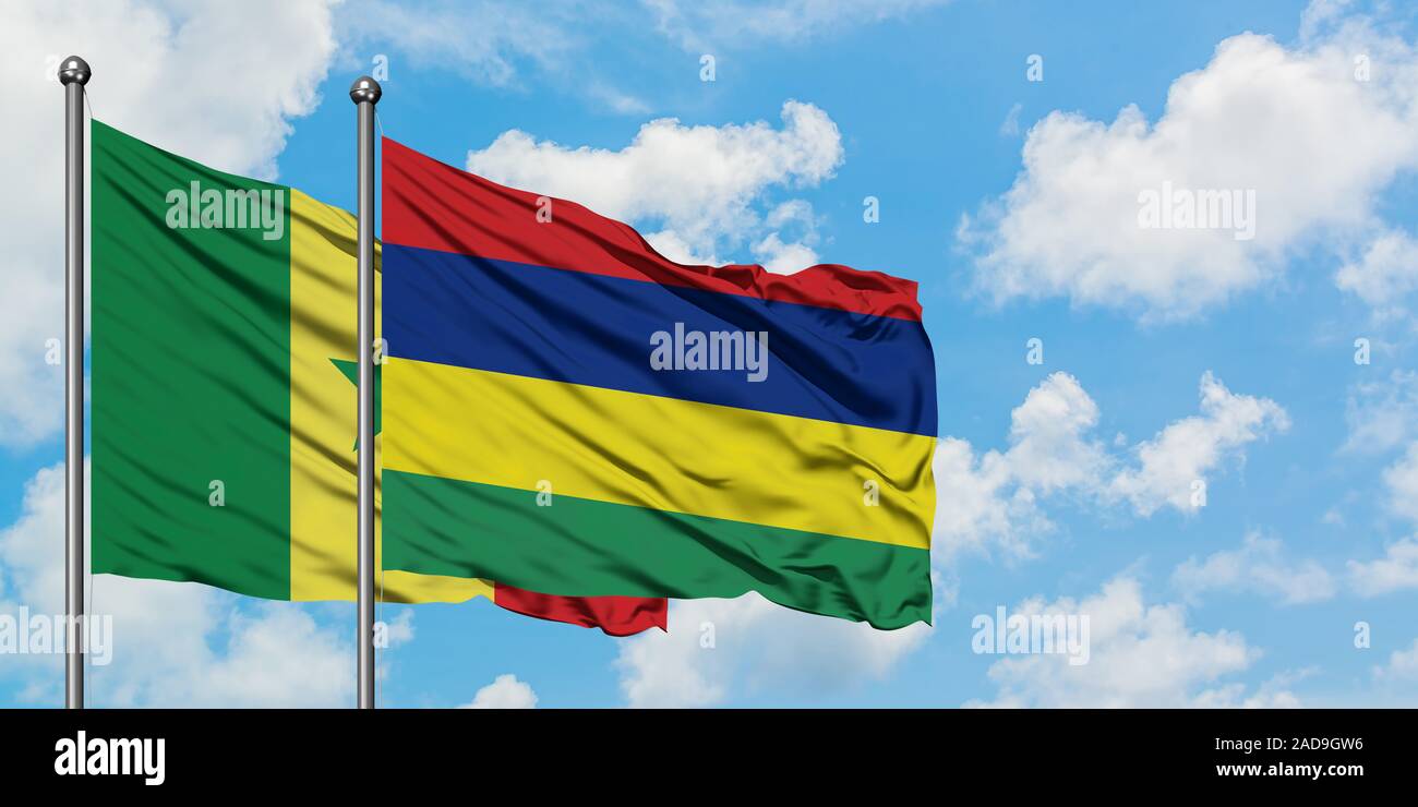 Senegal and Mauritius flag waving in the wind against white cloudy blue ...