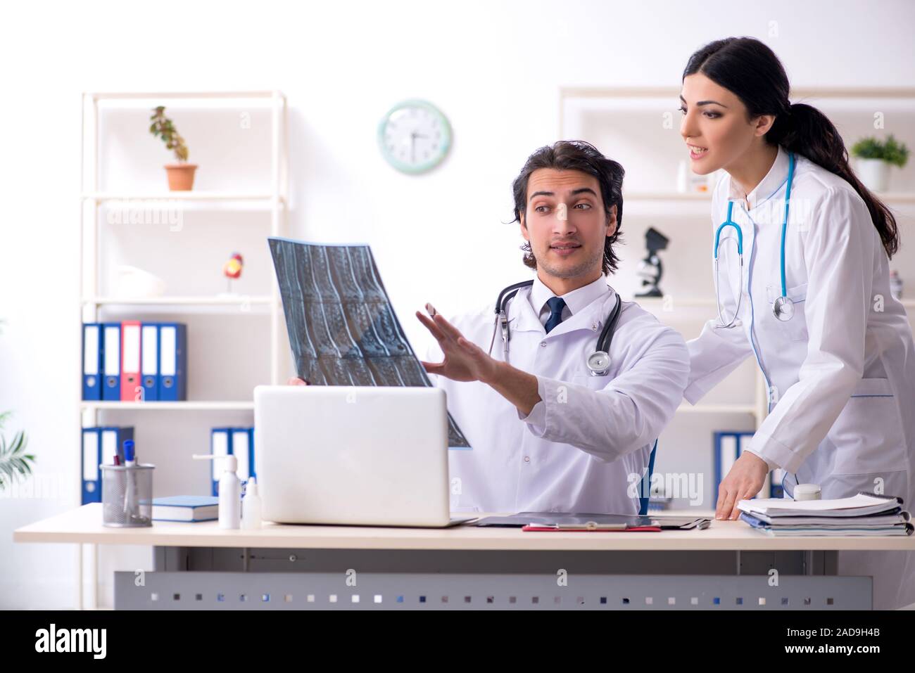 Two young doctors working in the clinic Stock Photo - Alamy