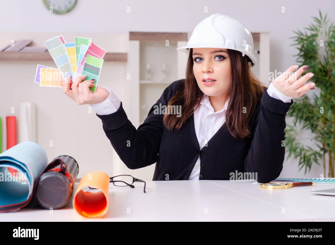 Female designer working in the office Stock Photo - Alamy