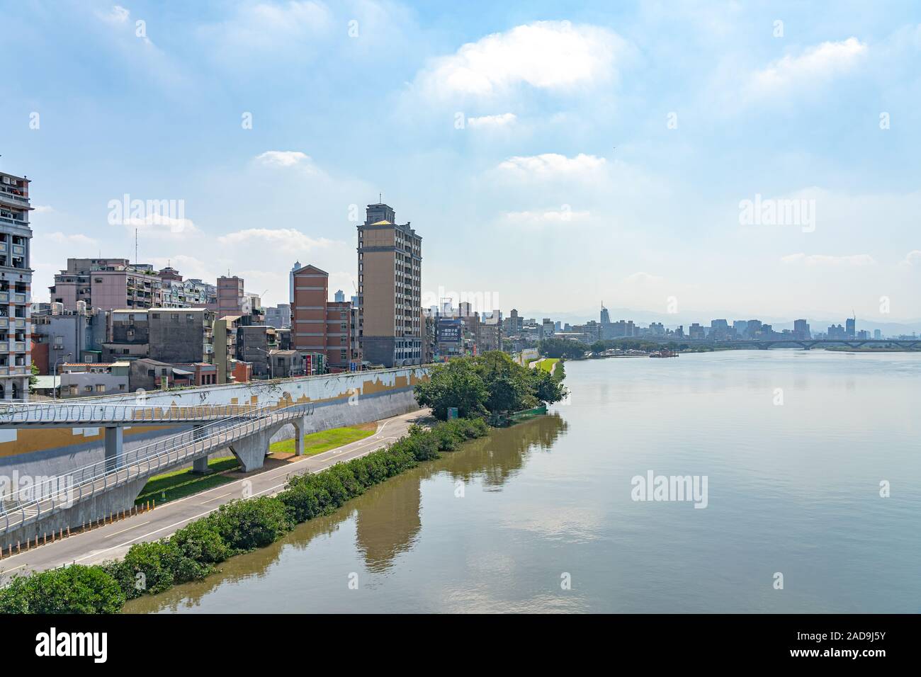 Scenery view of Tamsui river bank, view on Taipei bridge, a bridge link ...