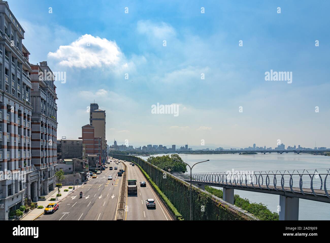Scenery view of Tamsui river bank, view on Taipei bridge, a bridge link ...