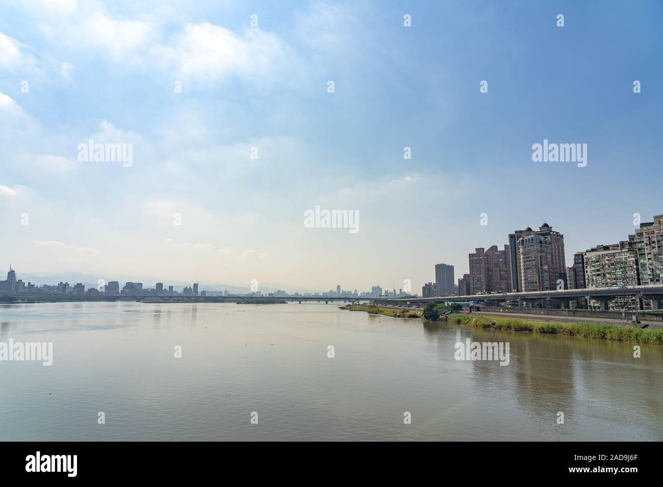 Scenery view of Tamsui river bank, view on Taipei bridge, a bridge link ...