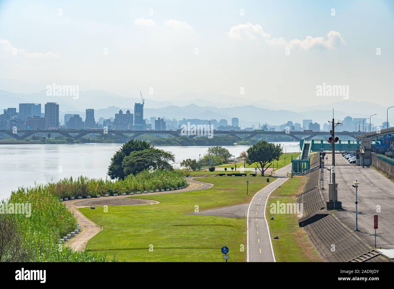 Scenery view of Tamsui river bank, view on Taipei bridge, a bridge link ...