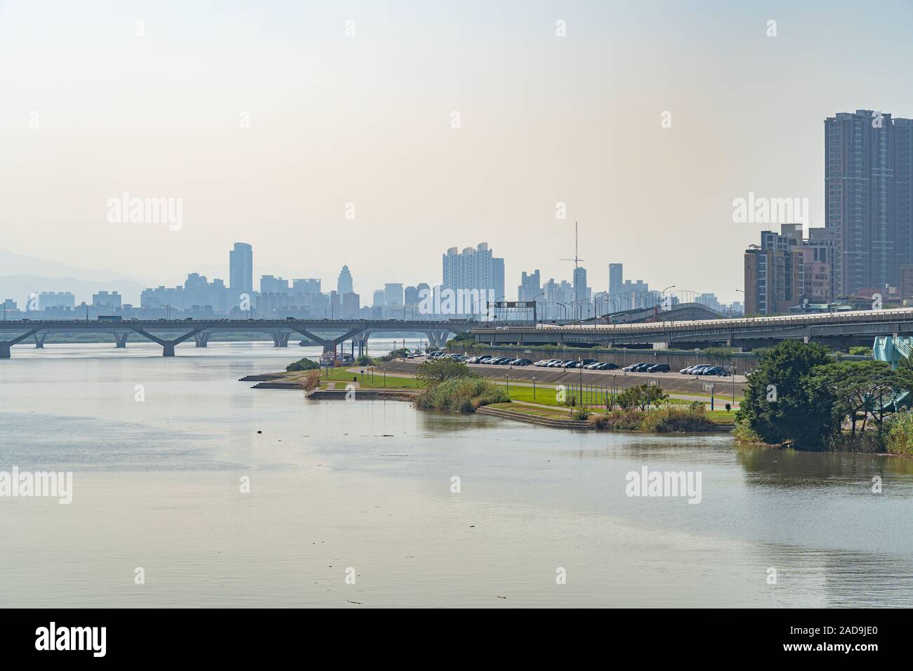 Scenery view of Tamsui river bank, view on Taipei bridge, a bridge link ...