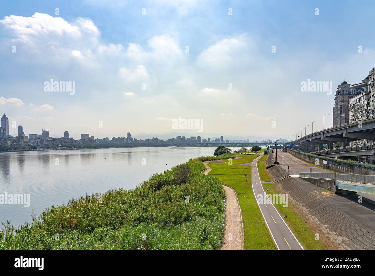 Scenery view of Tamsui river bank, view on Taipei bridge, a bridge link ...