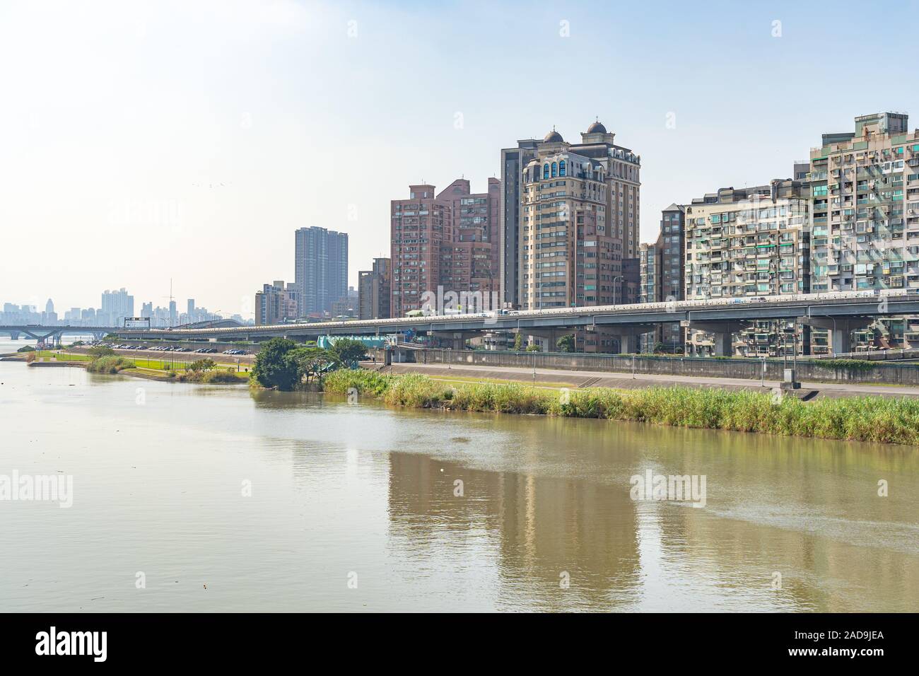 Scenery view of Tamsui river bank, view on Taipei bridge, a bridge link ...