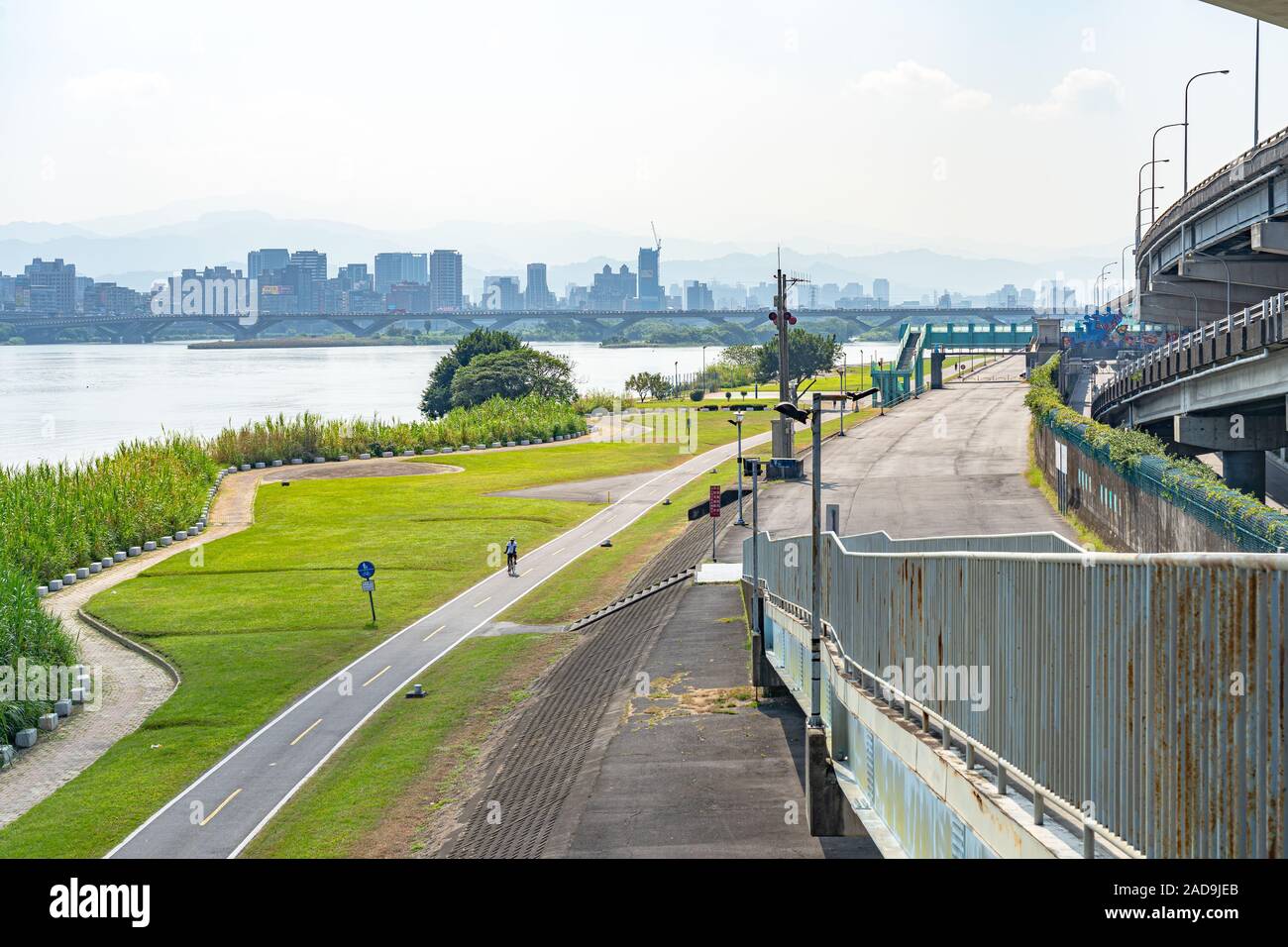 Scenery view of Tamsui river bank, view on Taipei bridge, a bridge link ...
