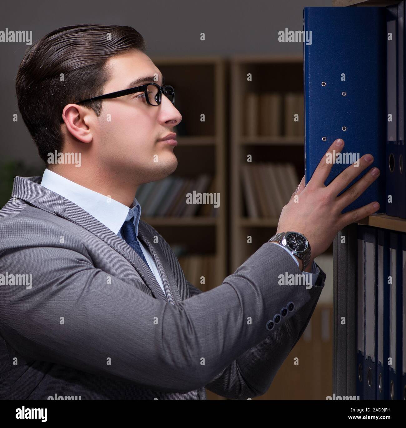 Businessman working late hours in the office Stock Photo - Alamy