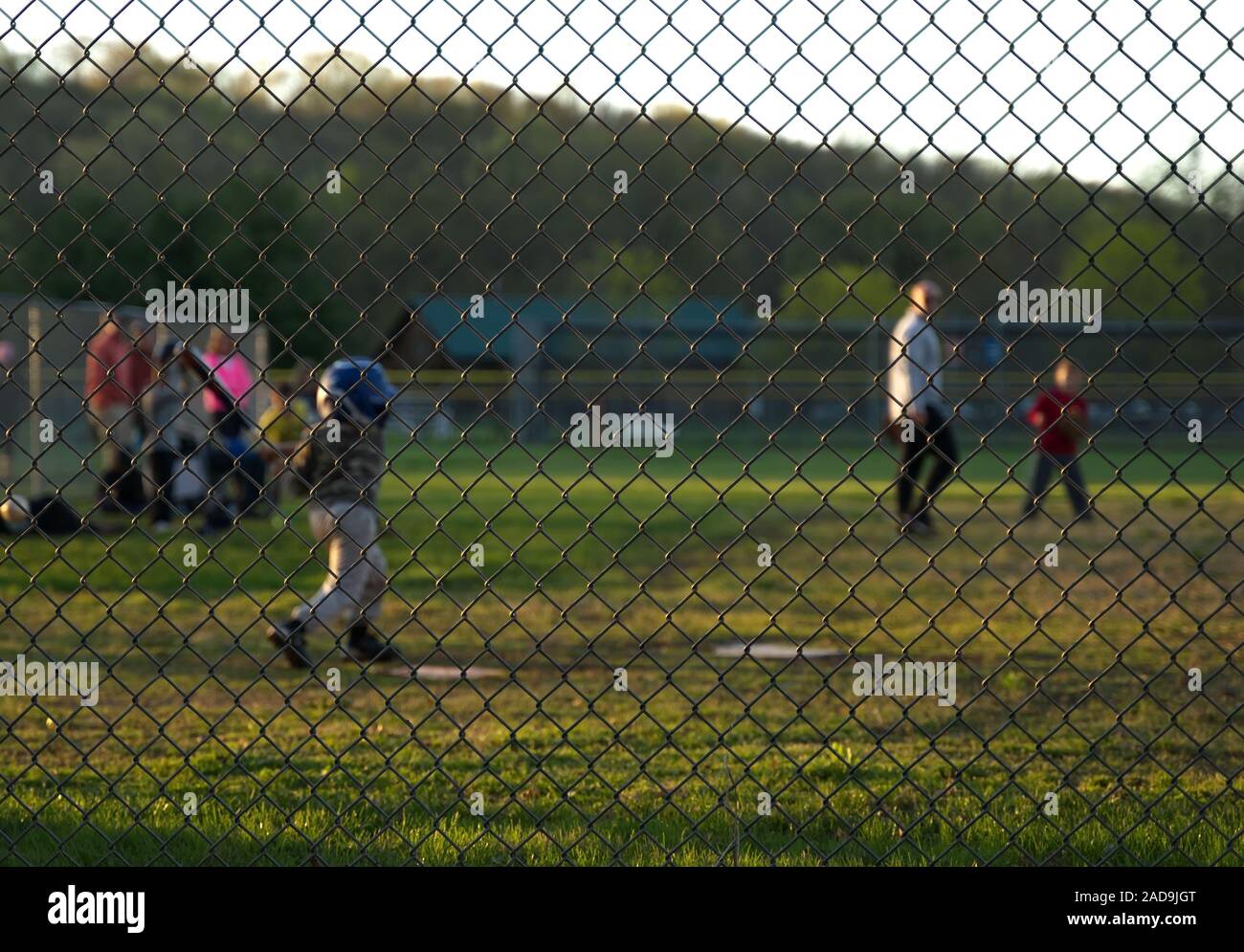 Industry standard galvanized chain link fence at a ball game protects ...