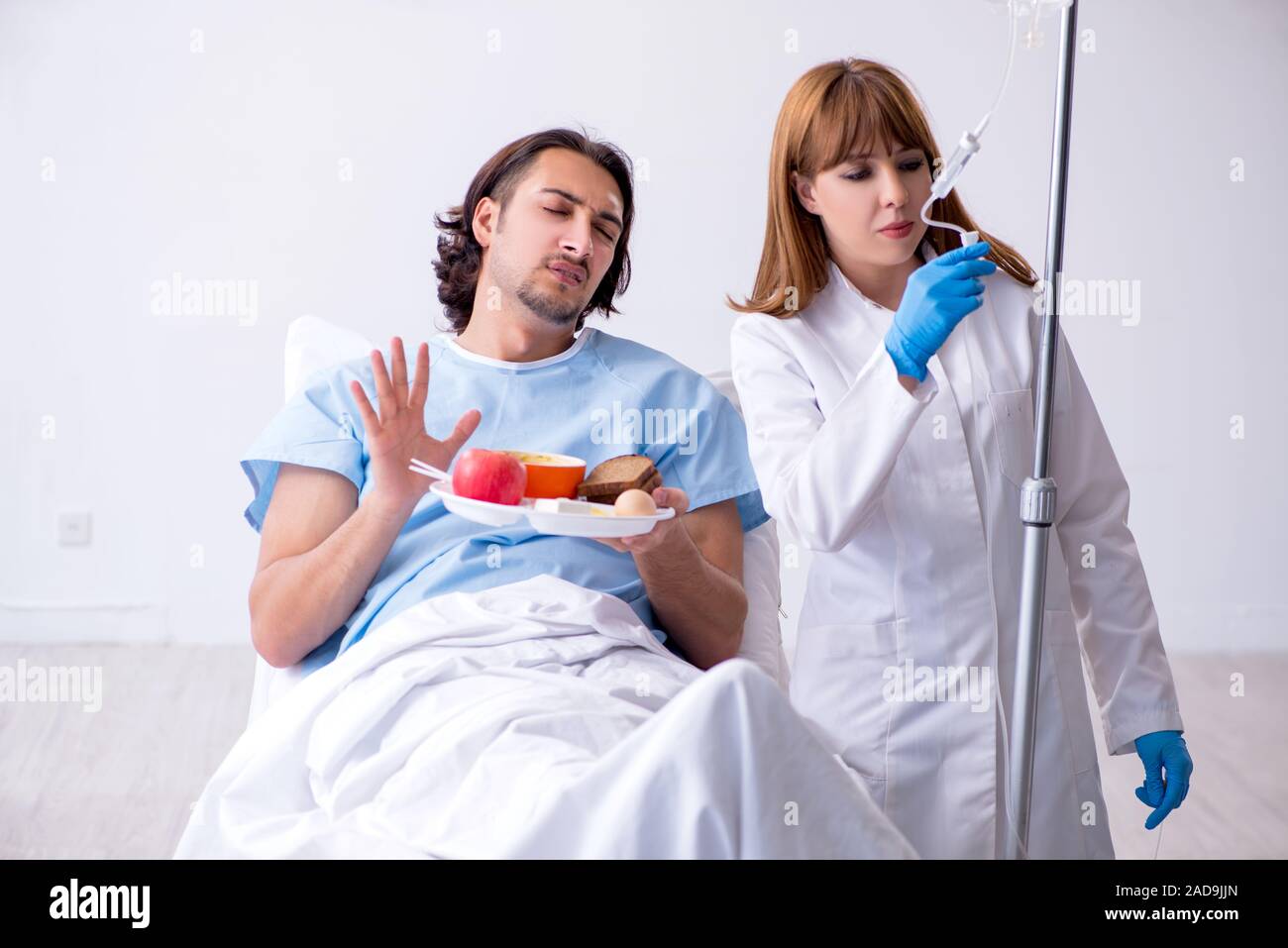Male patient eating food in the hospital Stock Photo - Alamy