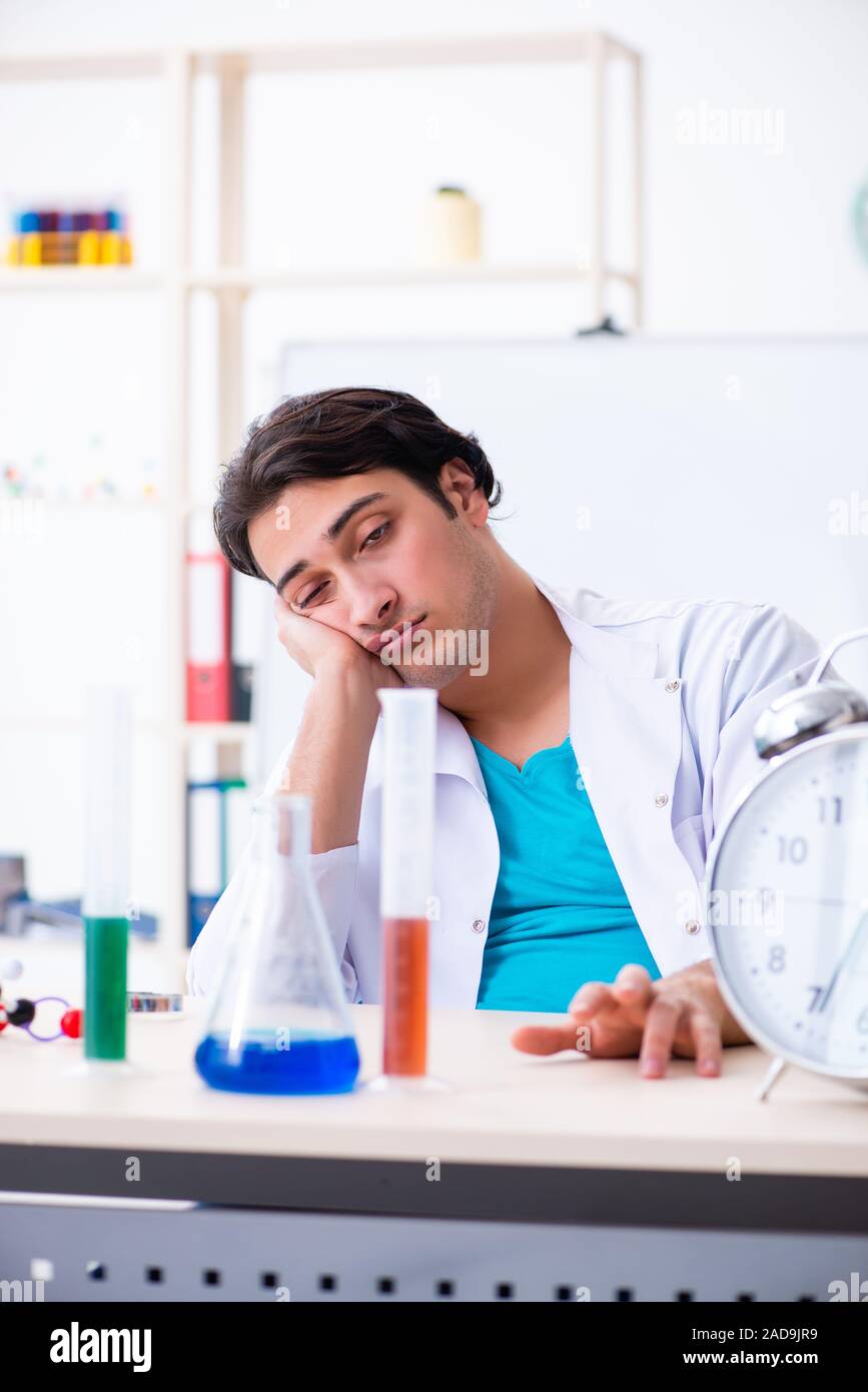 Young male chemist working in the lab Stock Photo - Alamy