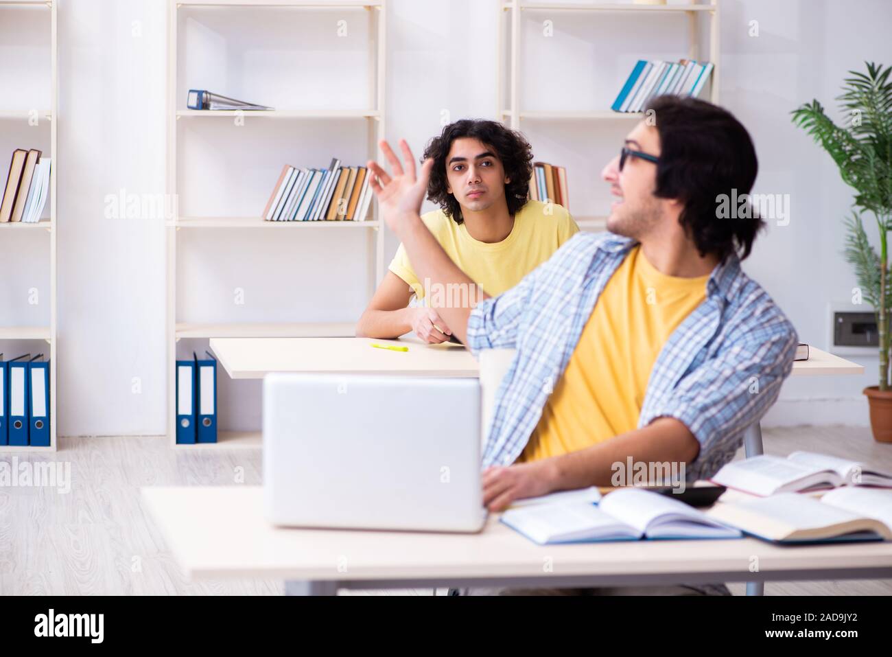 Two male students in the classroom Stock Photo - Alamy