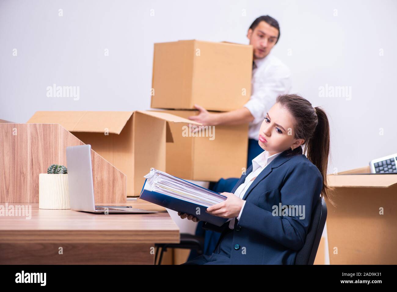 Two employees being fired from their work Stock Photo - Alamy