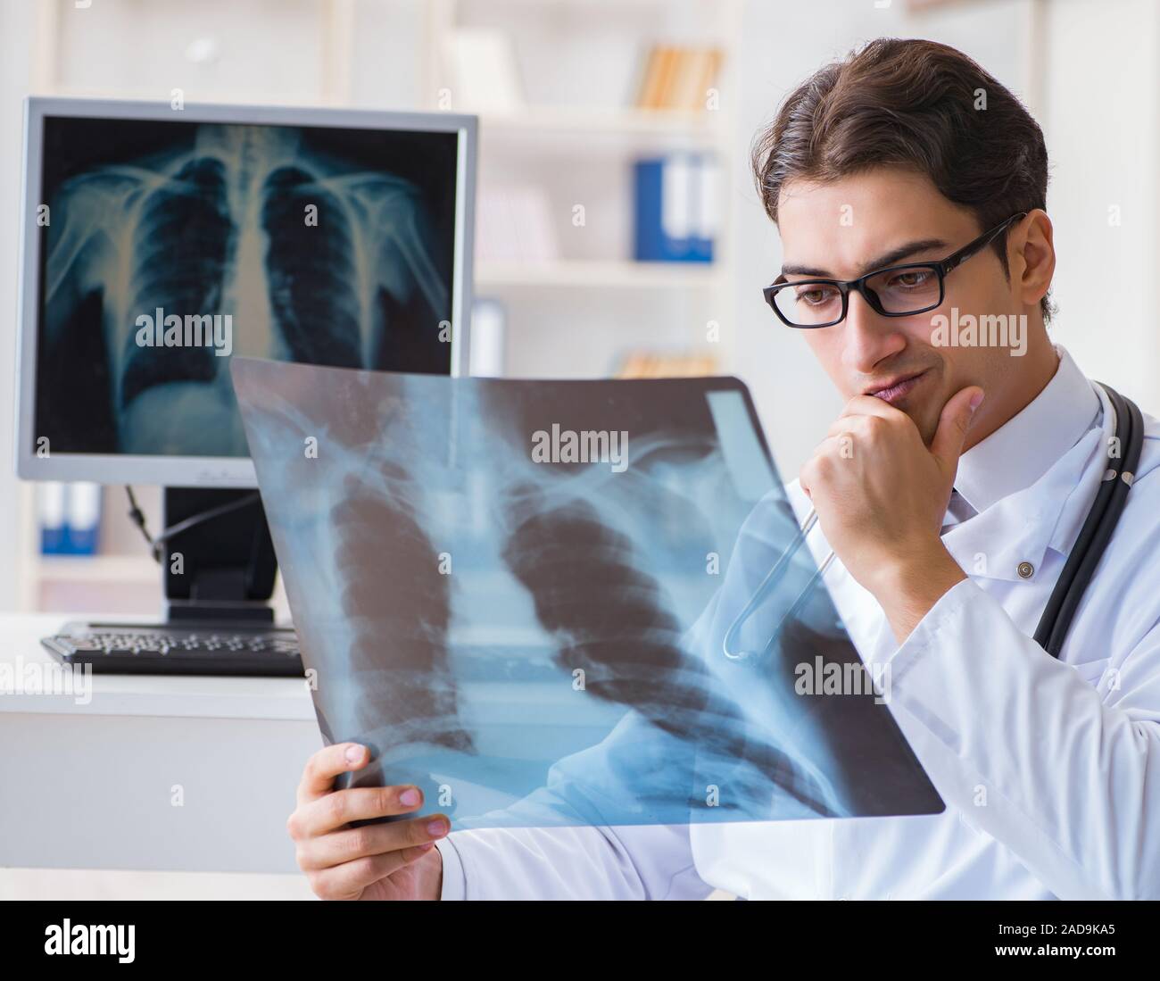 Doctor radiologist looking at x-ray images Stock Photo - Alamy