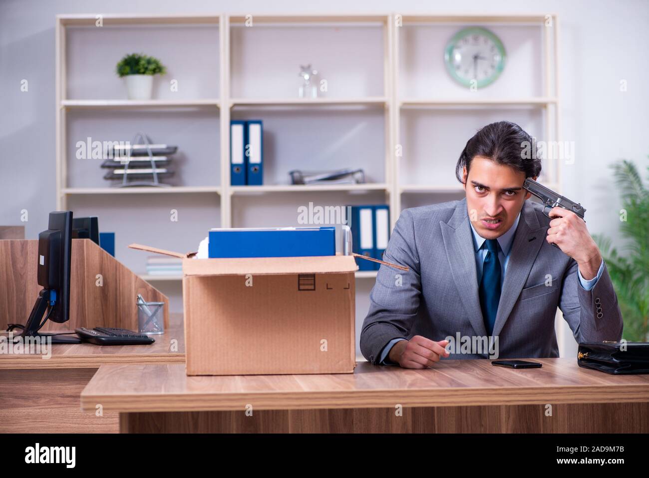 Young male employee being fired from his work Stock Photo - Alamy