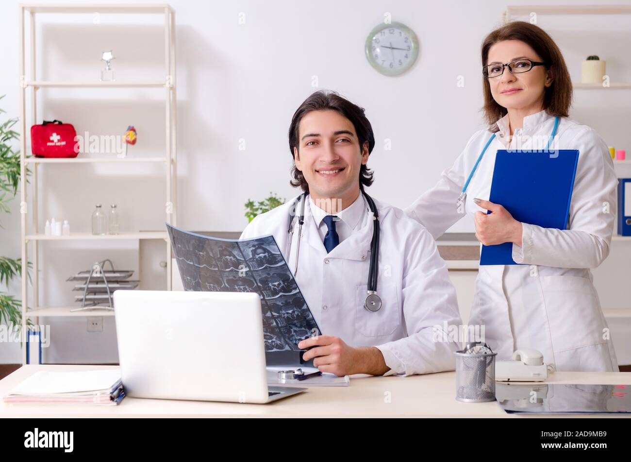 Two doctors working in the clinic Stock Photo - Alamy