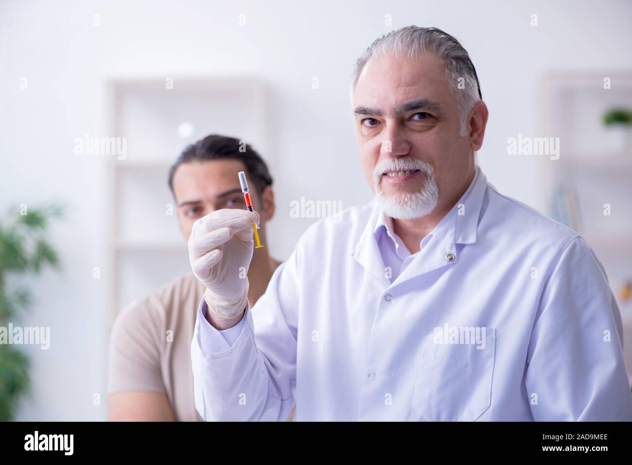 Male patient visitng doctor hi-res stock photography and images - Alamy
