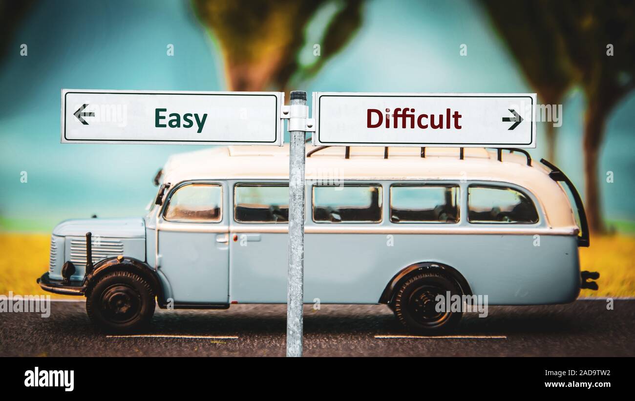Street Sign to Easy versus Difficult Stock Photo - Alamy