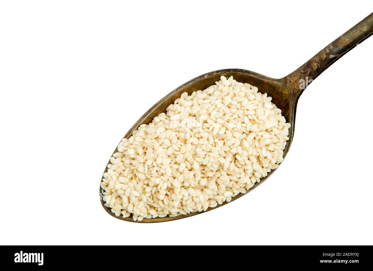 White sesame in a spoon isolated on a white background. Spice on ...