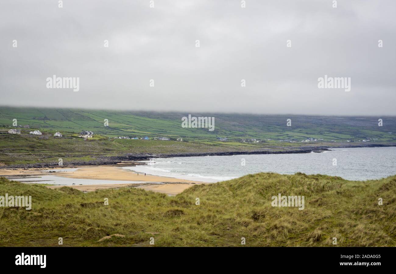 The burren with fog at dunes of fanore beach Stock Photo - Alamy