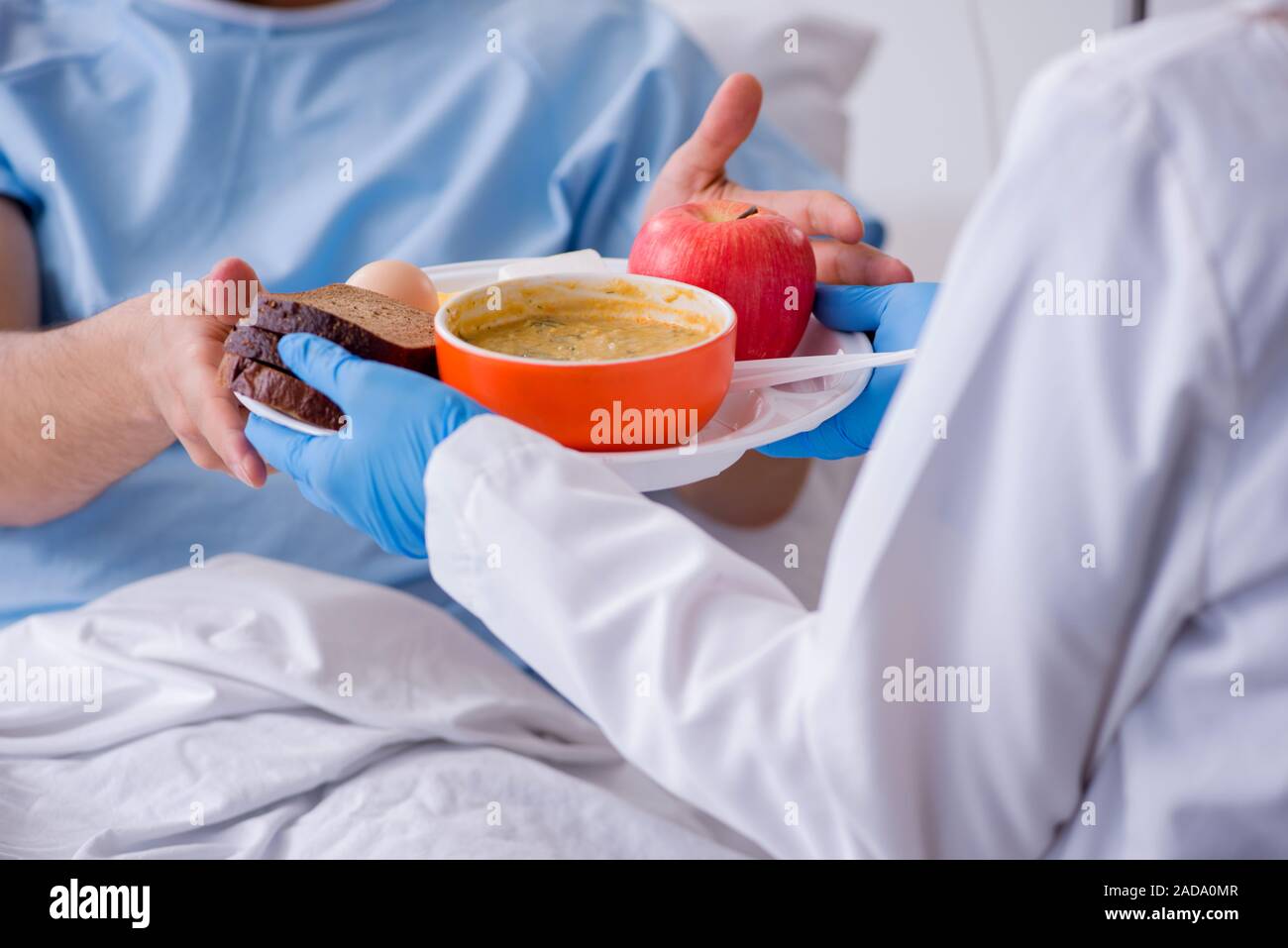 Male patient eating food in the hospital Stock Photo - Alamy